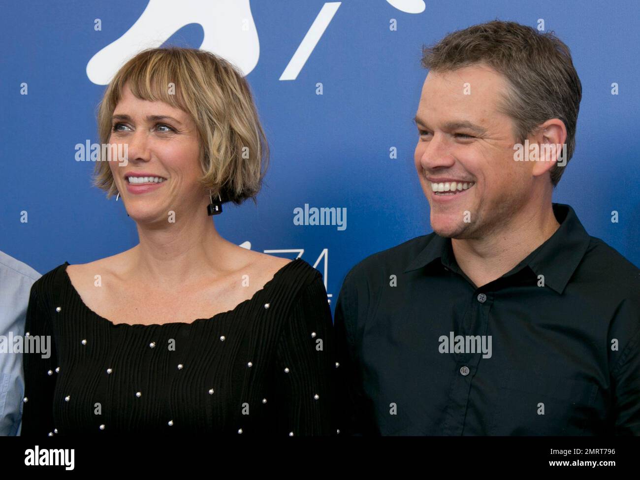 Actors Kristen Wiig, left, and Matt Damon pose for photographers at the ...