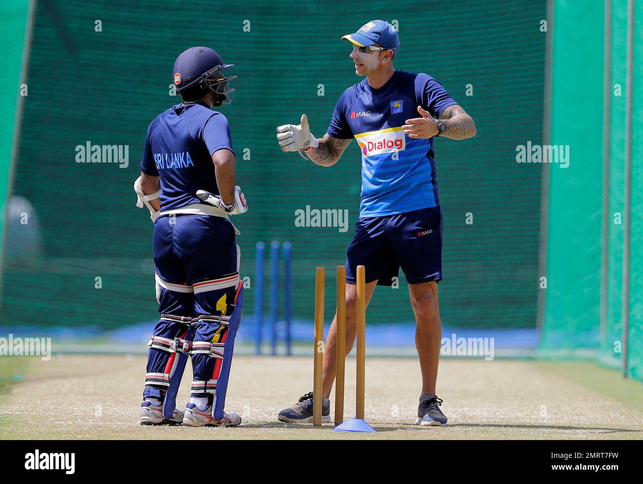Sri Lankan cricket team coach Nic Pothas, right, instructs batsman ...