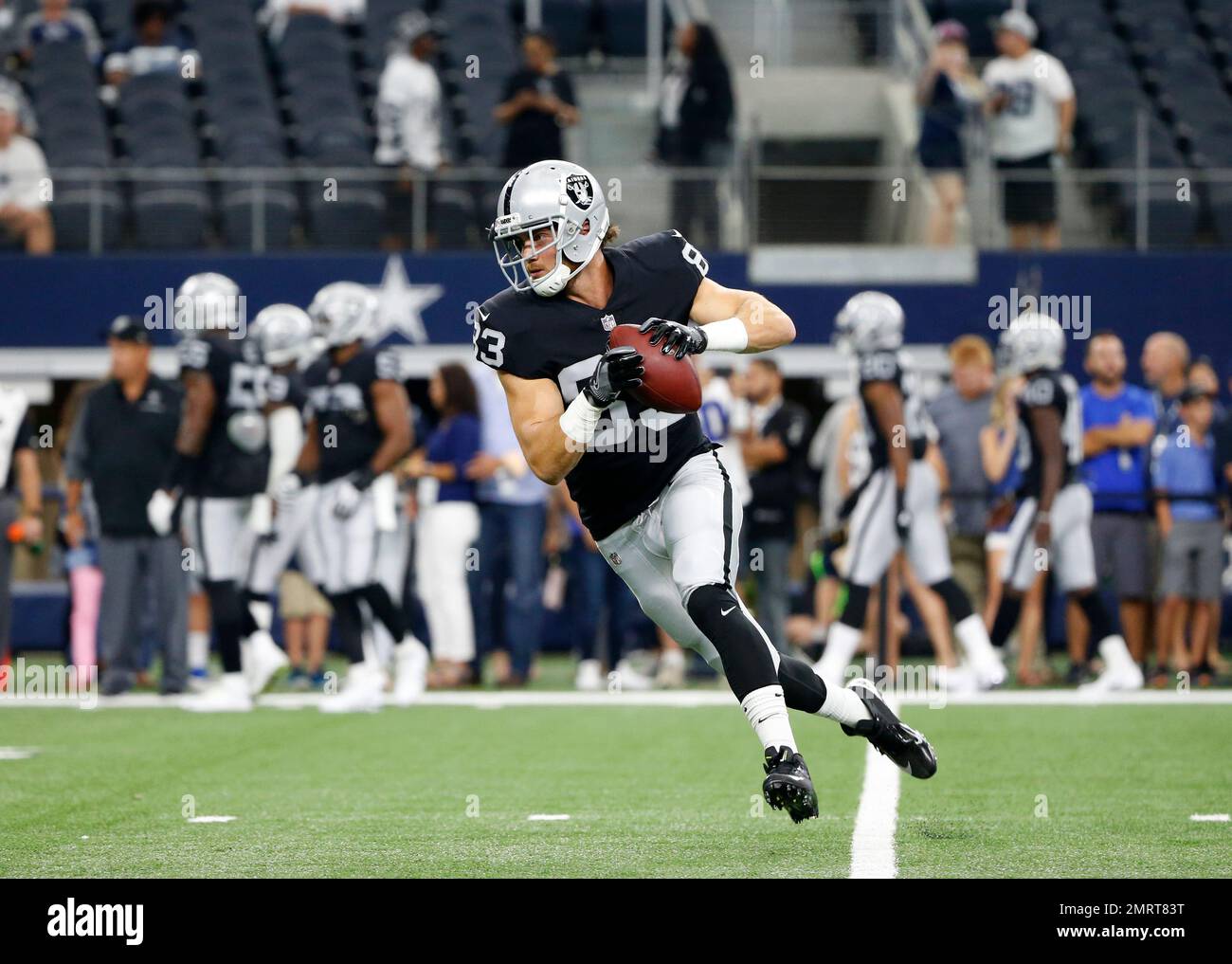 Oakland Raiders tight end Cooper Helfet (83) catches a pass during warm ...
