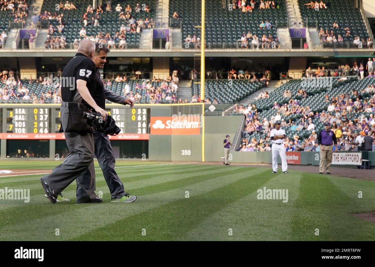 Home plate umpire Mike Everitt leaves the game in the middle of the ...