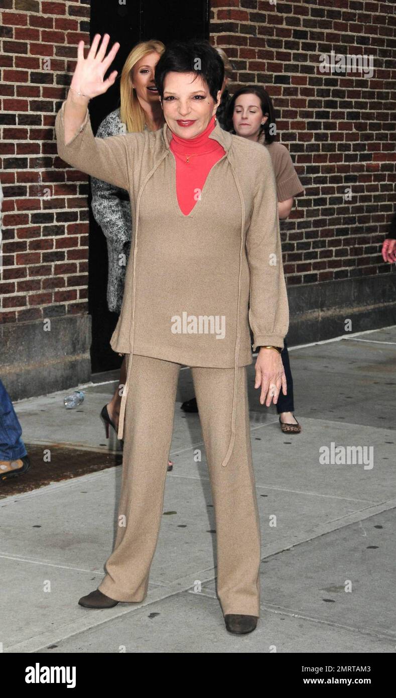 Legendary singer and actress Liza Minnelli, 64, waves to fans as she ...