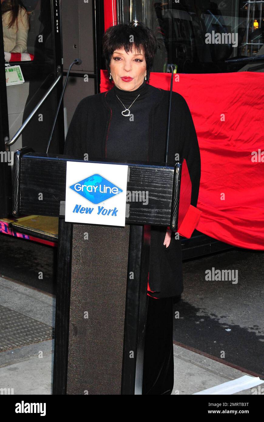 Veteran performer and singer Liza Minnelli cuts the ribbon, cheerfully ...