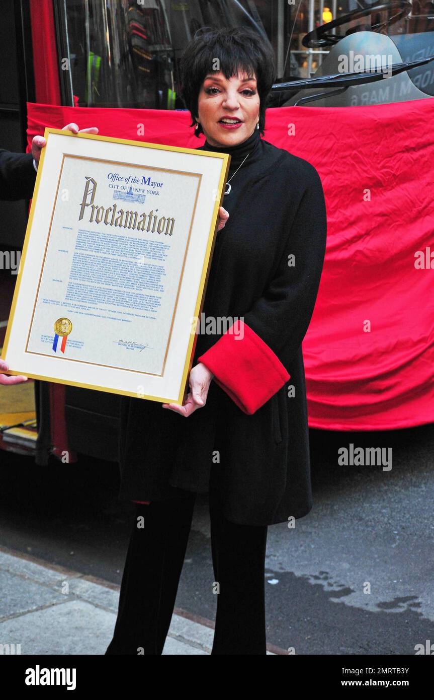 Veteran performer and singer Liza Minnelli cuts the ribbon, cheerfully ...