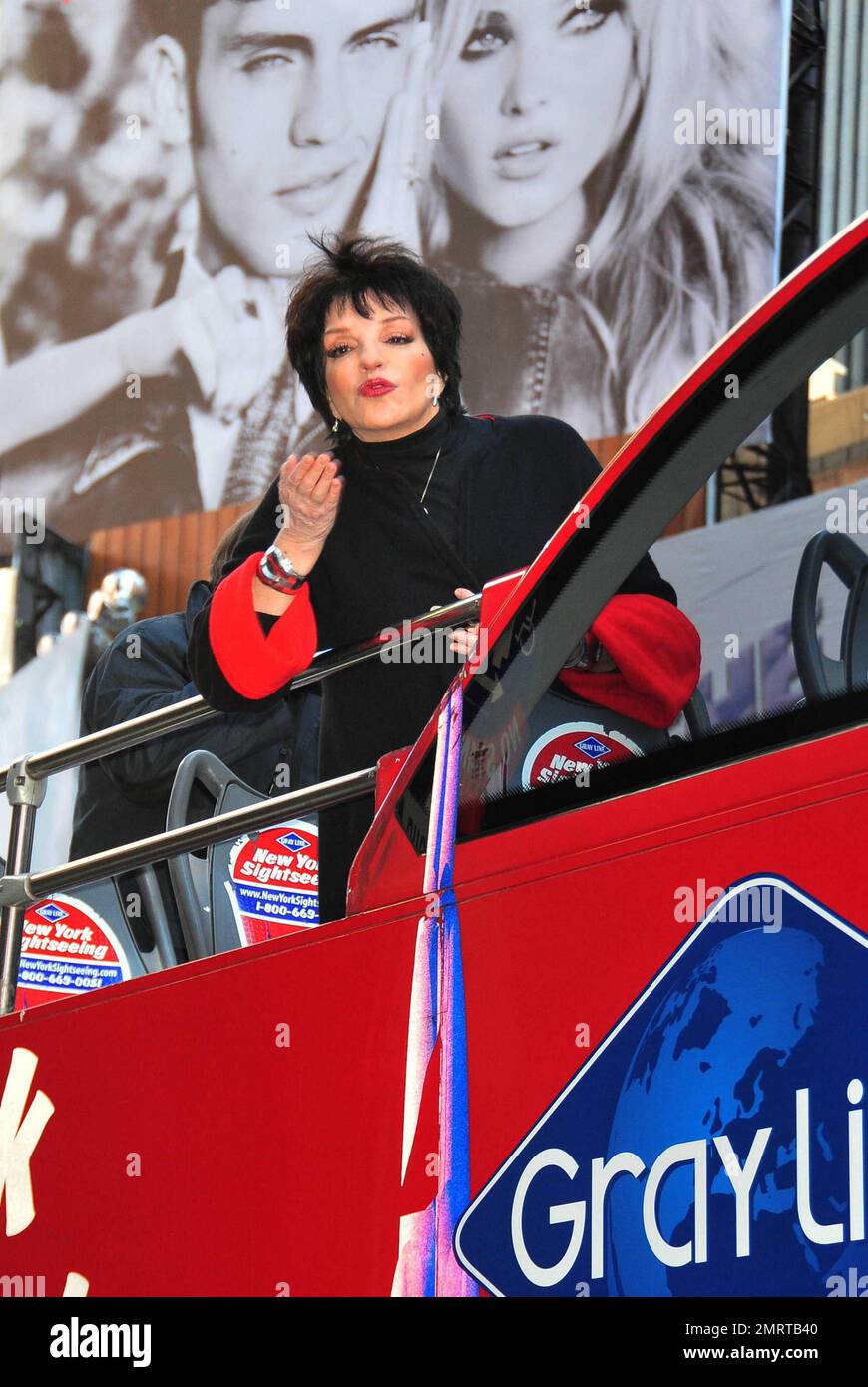Veteran performer and singer Liza Minnelli cuts the ribbon, cheerfully ...