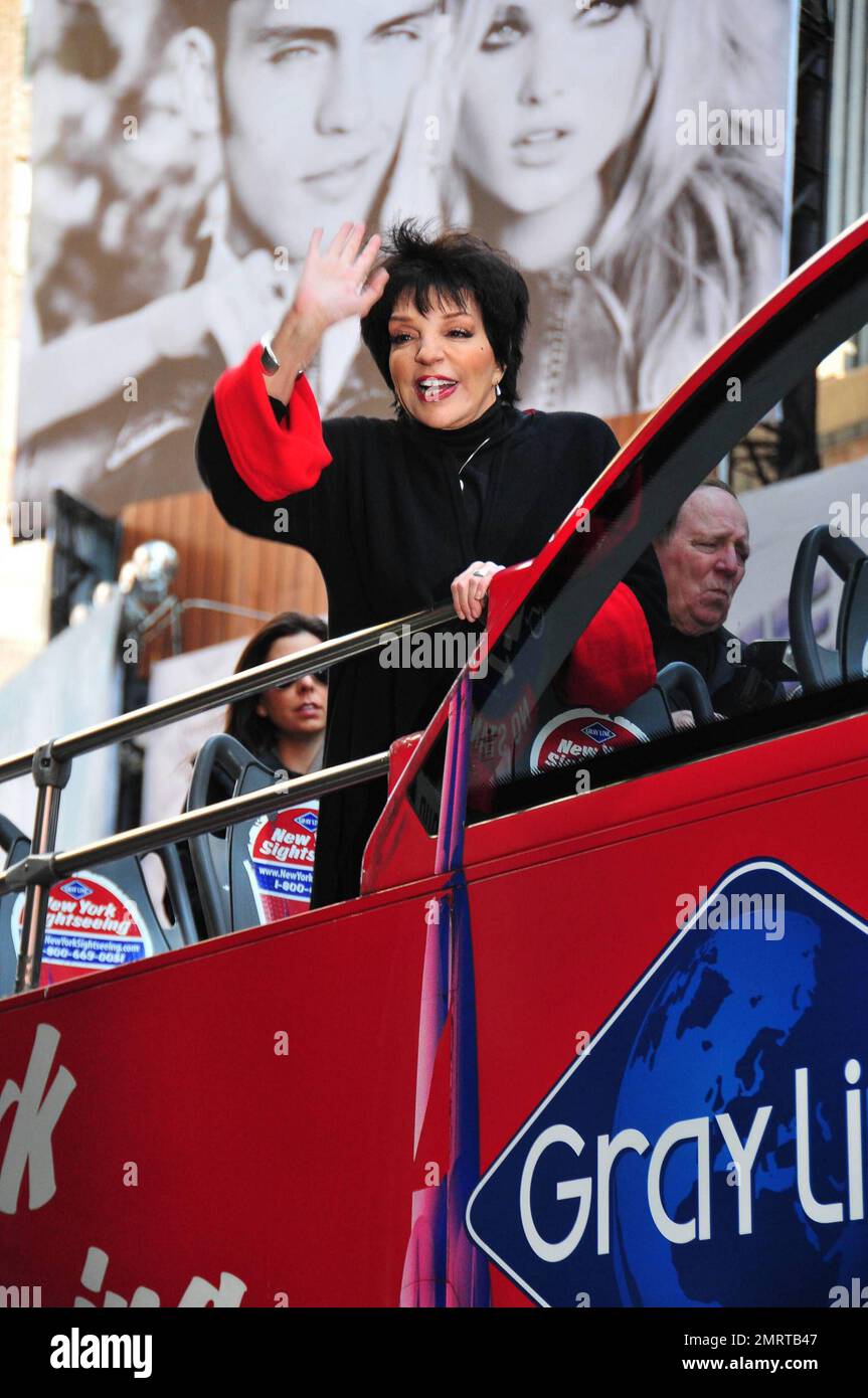 Veteran performer and singer Liza Minnelli cuts the ribbon, cheerfully ...
