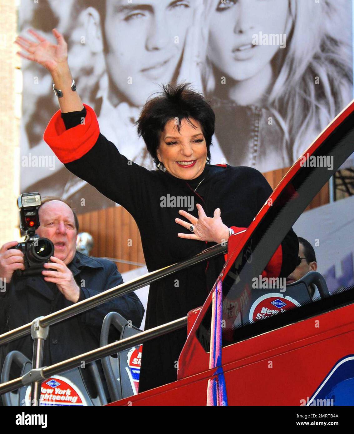 Veteran performer and singer Liza Minnelli cuts the ribbon, cheerfully ...