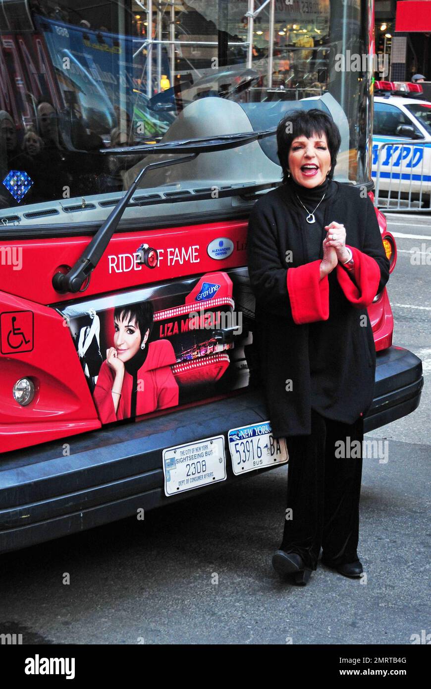 Veteran performer and singer Liza Minnelli cuts the ribbon, cheerfully ...