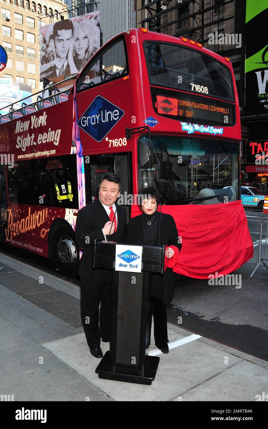 Veteran performer and singer Liza Minnelli cuts the ribbon, cheerfully ...