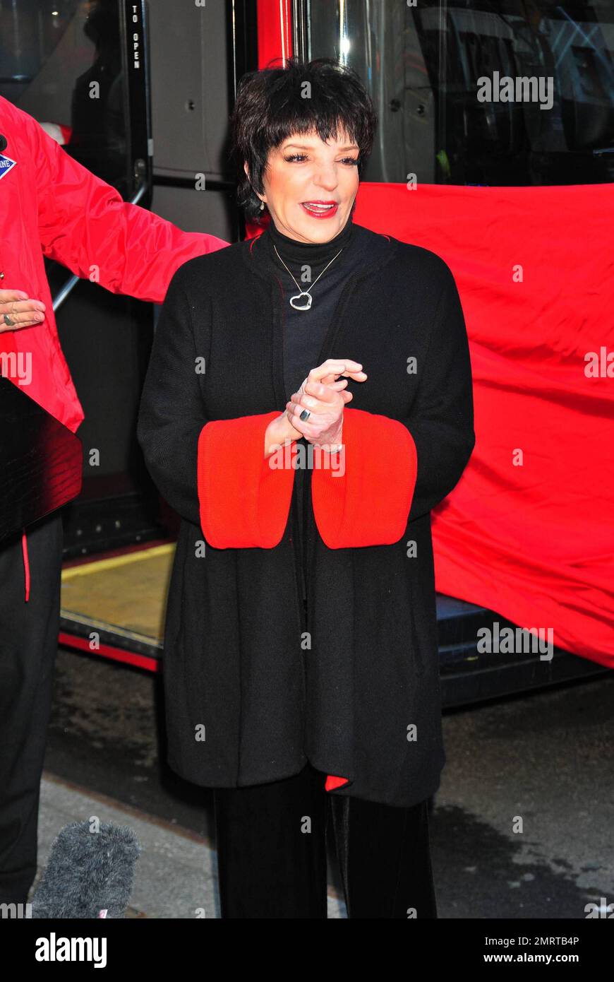 Veteran performer and singer Liza Minnelli cuts the ribbon, cheerfully ...