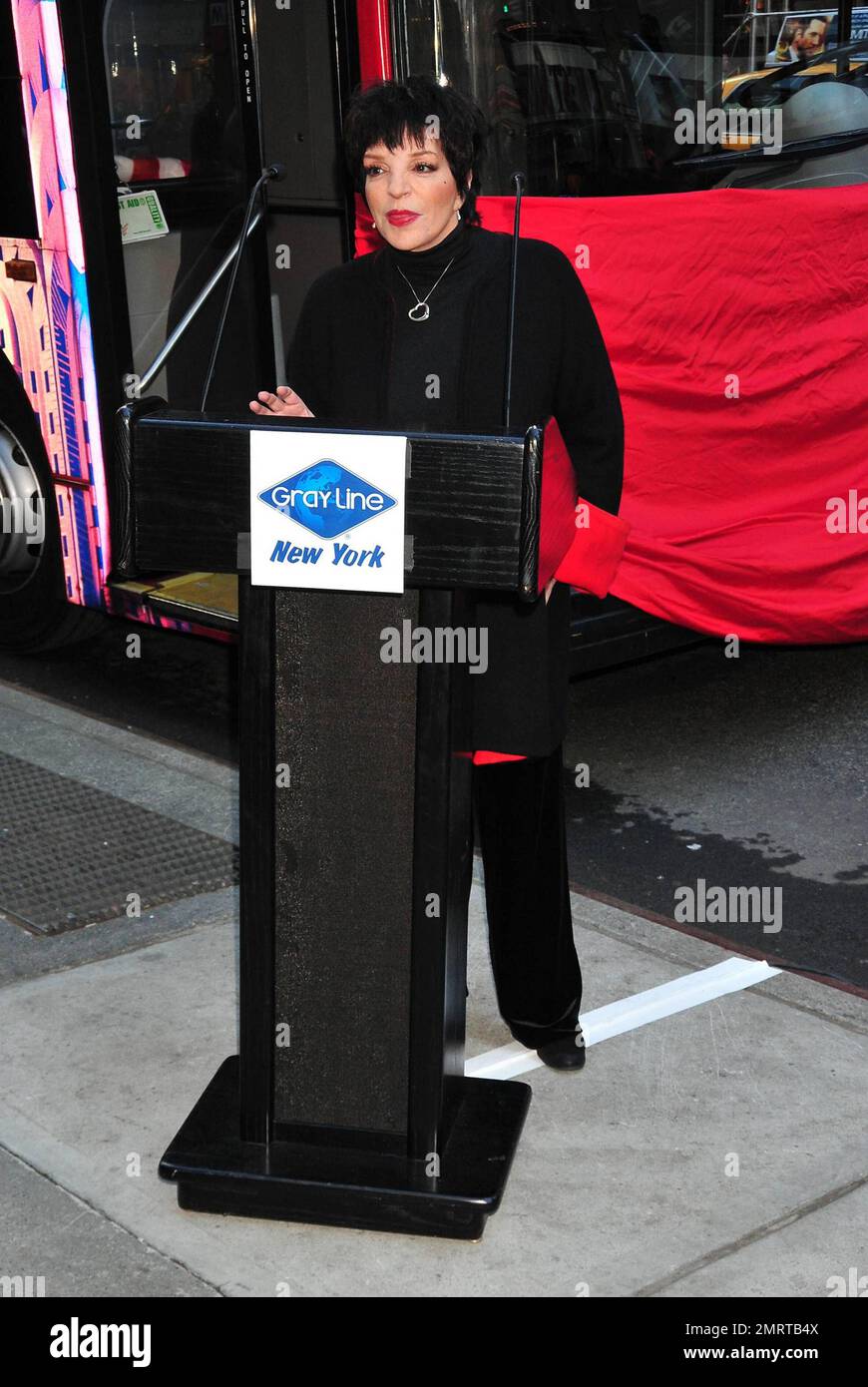 Veteran performer and singer Liza Minnelli cuts the ribbon, cheerfully ...