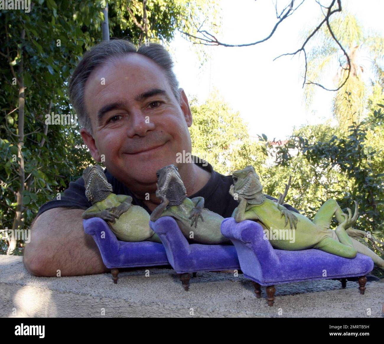 Exclusive!! Henry Lizardlover snuggles up with some of his lizard ...