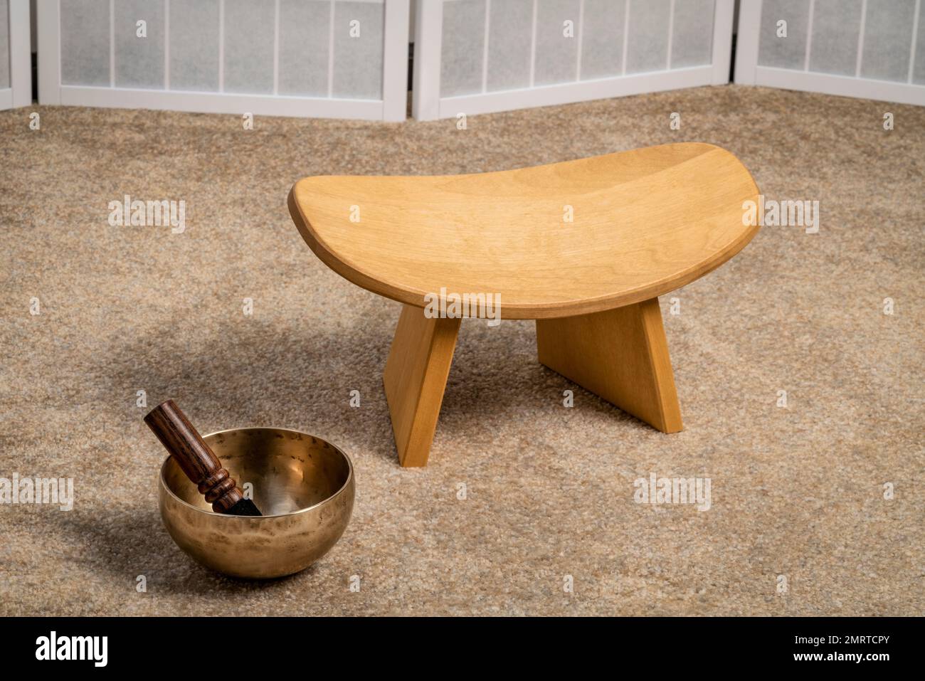 Tibetan singing bowl and meditation, kneeling bench to sit in a natural ...