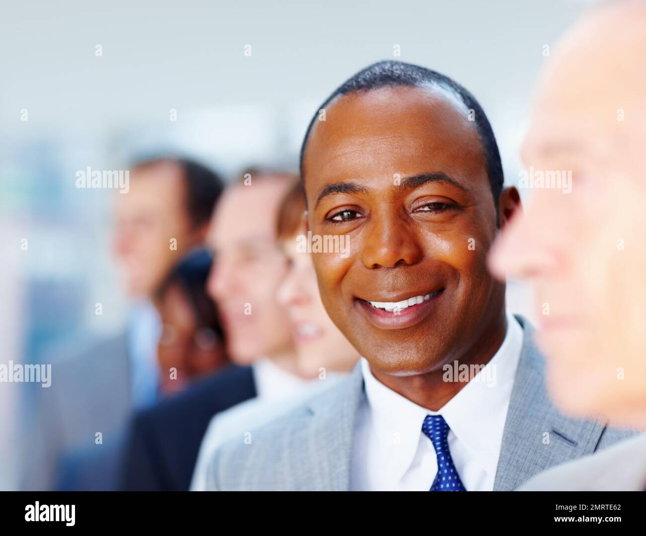Happy executive with team. Focus on Business man with colleagues in ...
