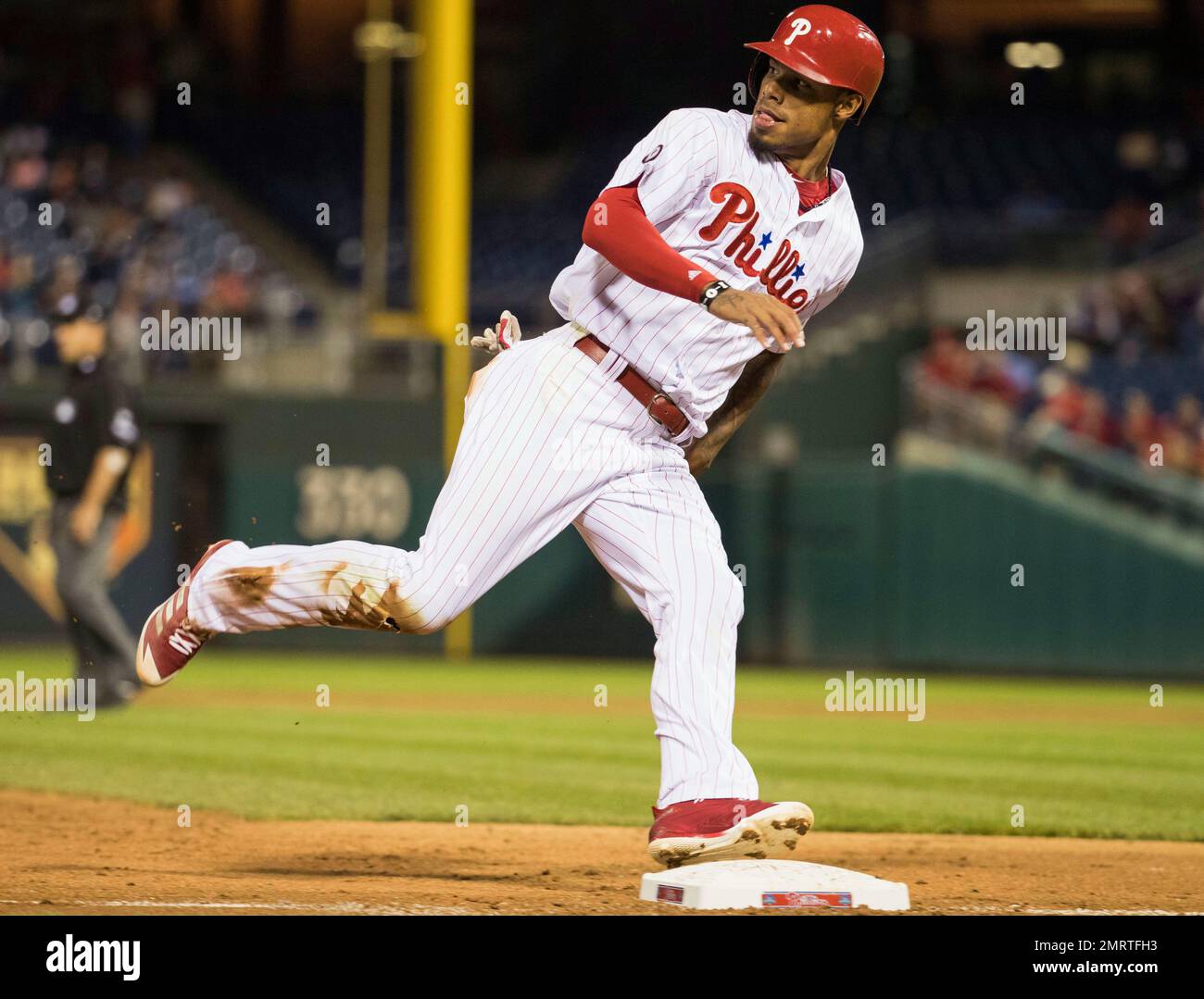 Philadelphia Phillies' Nick Williams looks back as he rounds third base ...