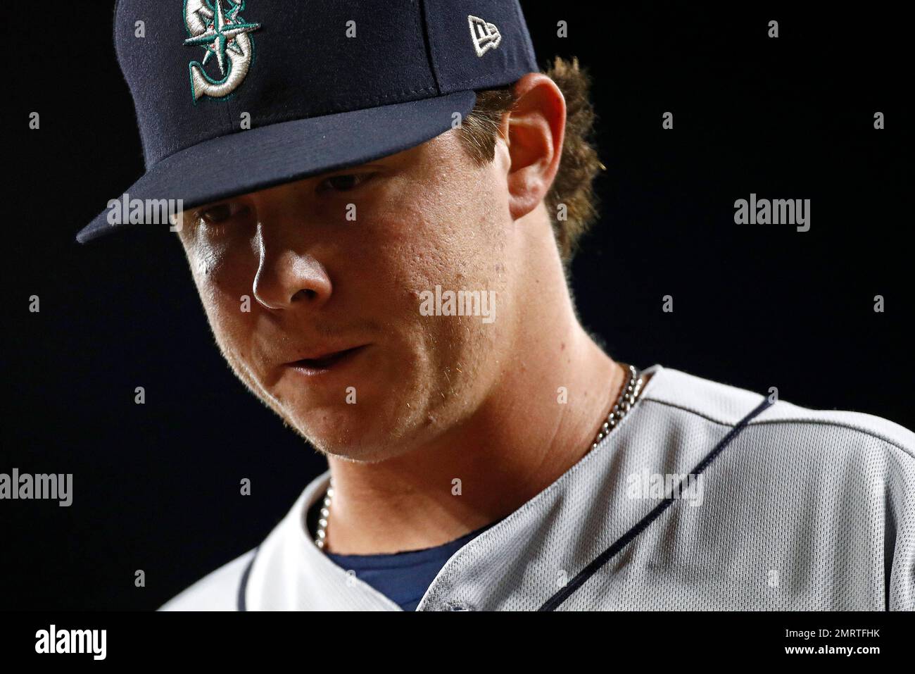 Seattle Mariners relief pitcher Emilio Pagan walks off the field after ...