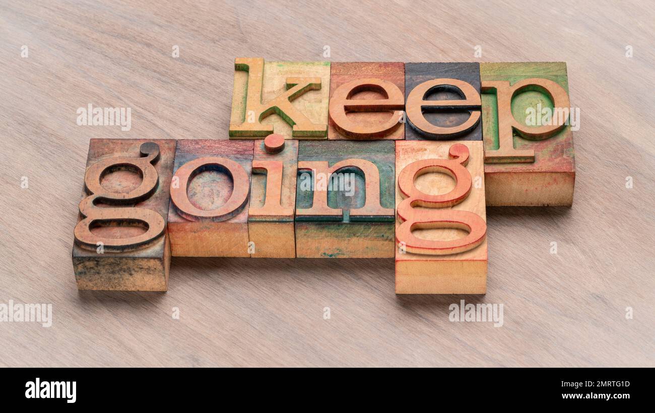 keep going word abstract in letterpress wood type, motivation concept ...