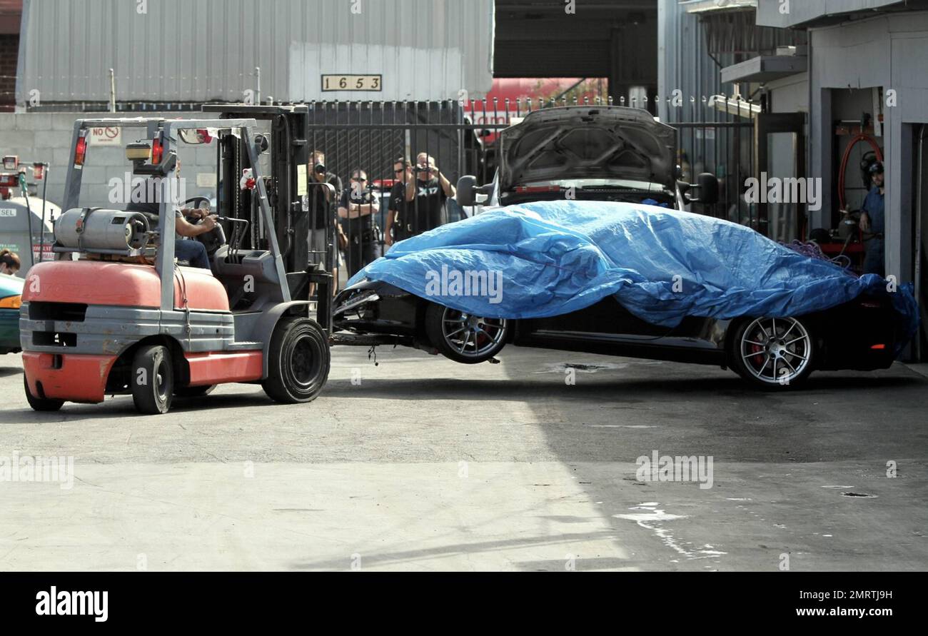 Forensics police search the contents of Lindsay Lohan's wrecked Porsche ...