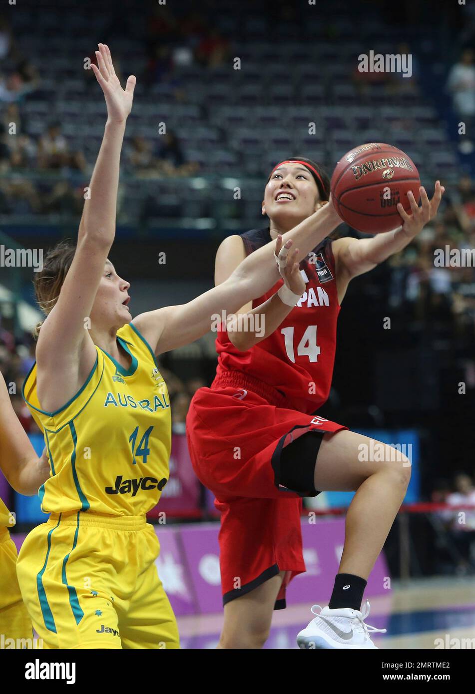 Australia's Darcee Lee Garbin, left, defends as Japan''s Tamami Nakada ...