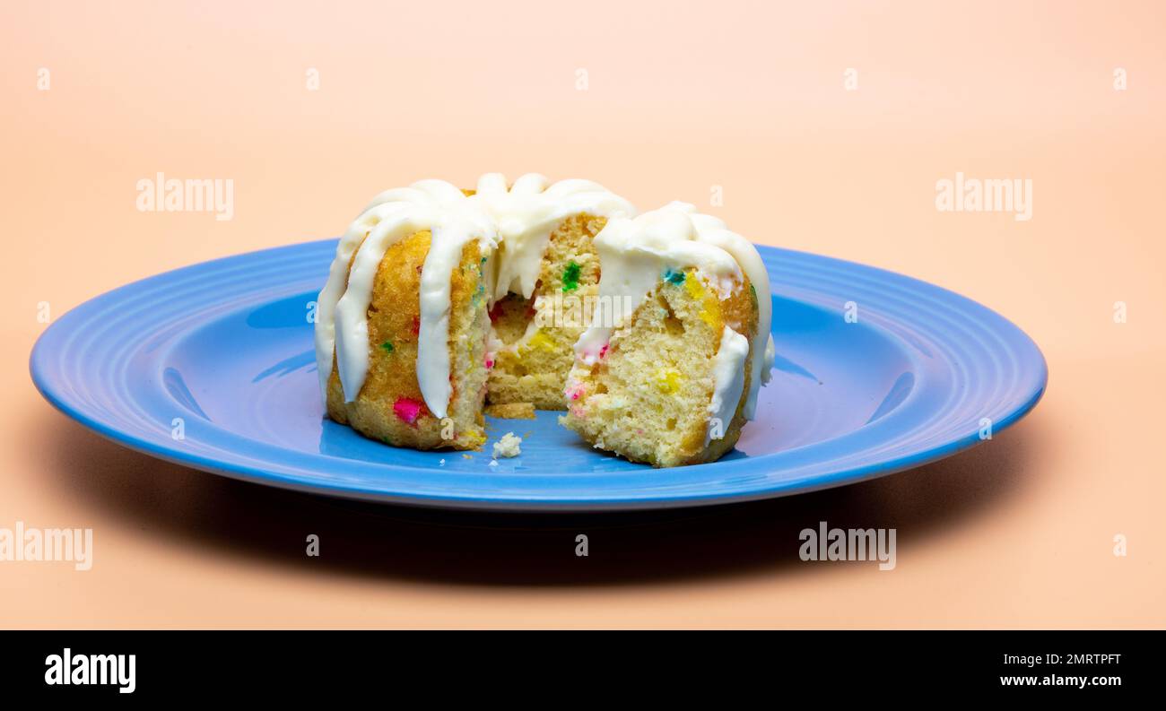 Confetti Bunt Cake on blue plate Stock Photo - Alamy