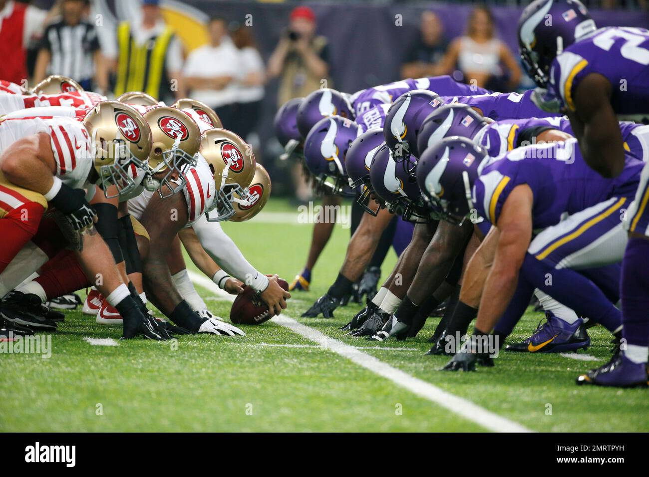 Players get set on the line of scrimmage during the first half of an ...