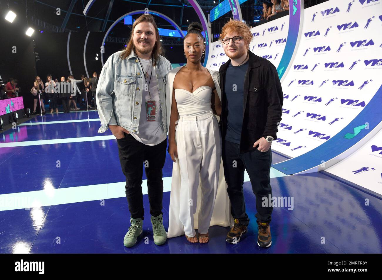 Jason Koenig, from left, Jennie Pegouskie and Ed Sheeran arrives at the ...