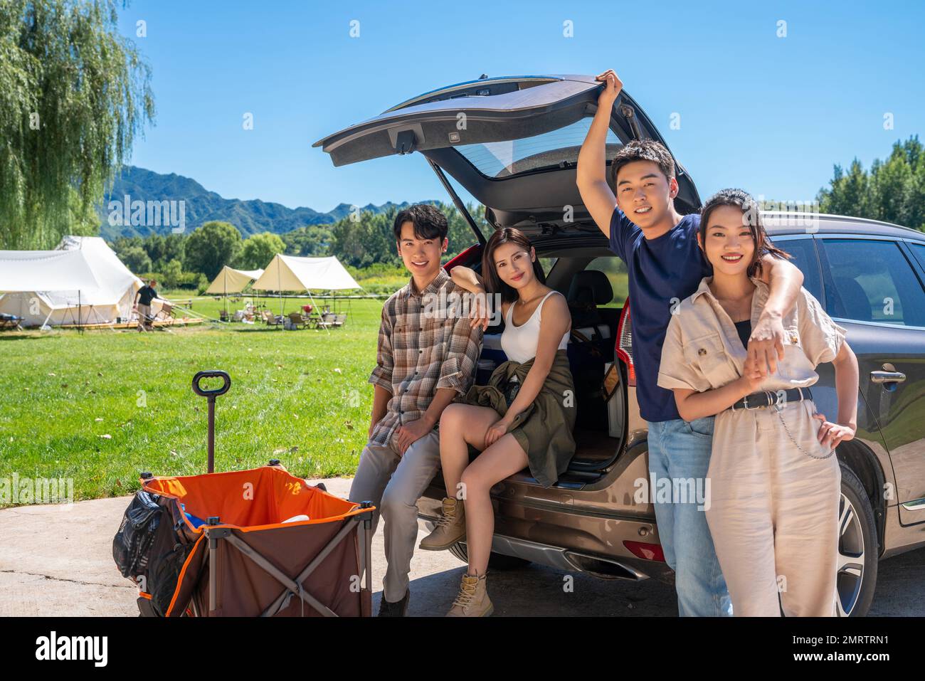 A group of people at the campsite Stock Photo - Alamy