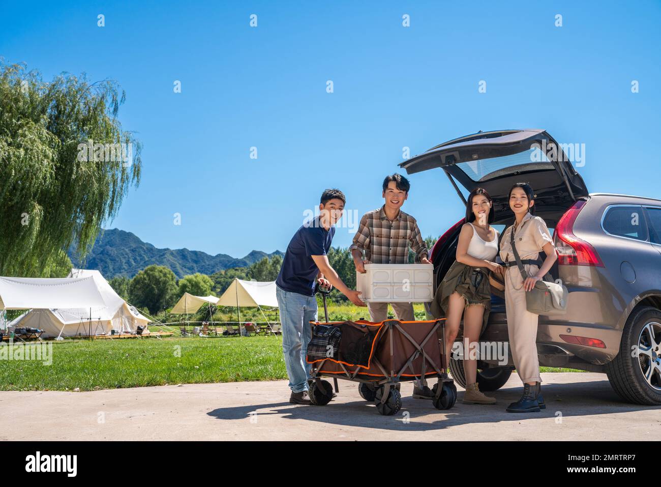 A group of people at the campsite Stock Photo - Alamy