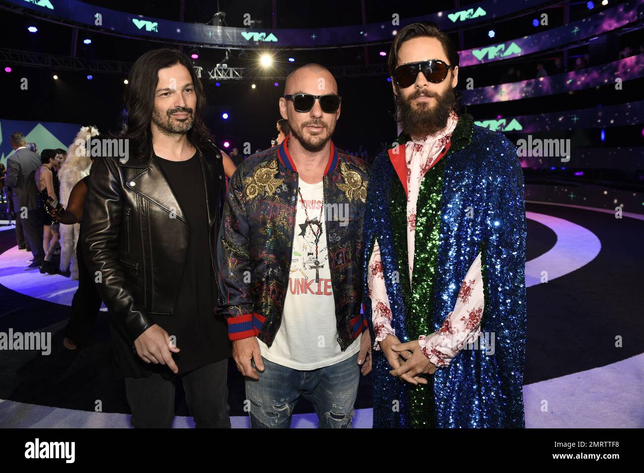 Tomo Milicevic, from left, Shannon Leto and Jared Leto arrives at the ...