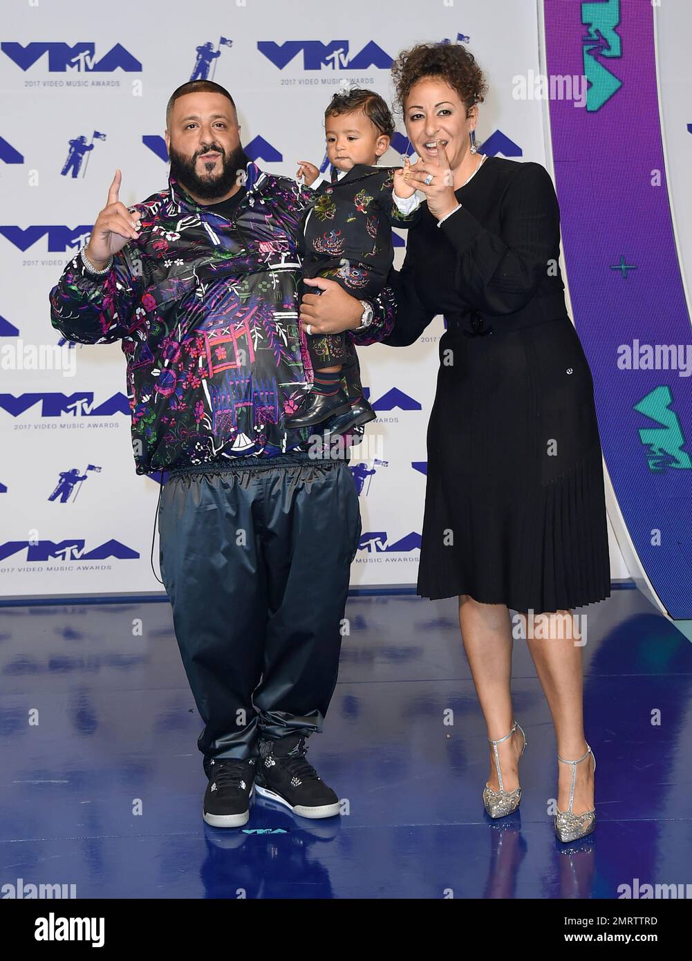 DJ Khaled, left, Nicole Tuck, right, and their son Asahd arrive at the ...