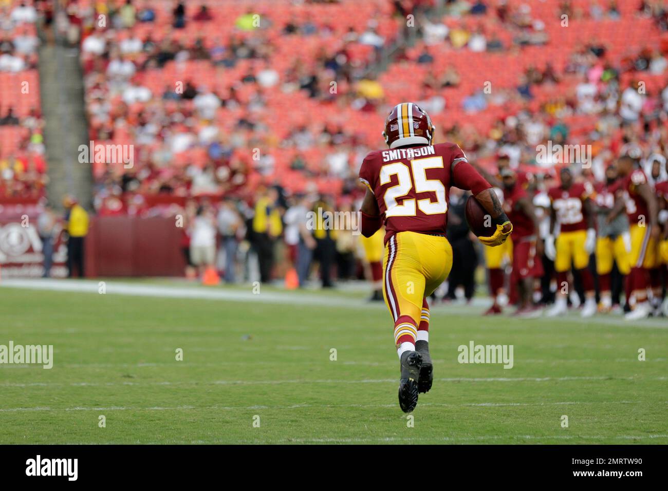 Washington Redskins defensive back Fish Smithson rushes the ball after ...