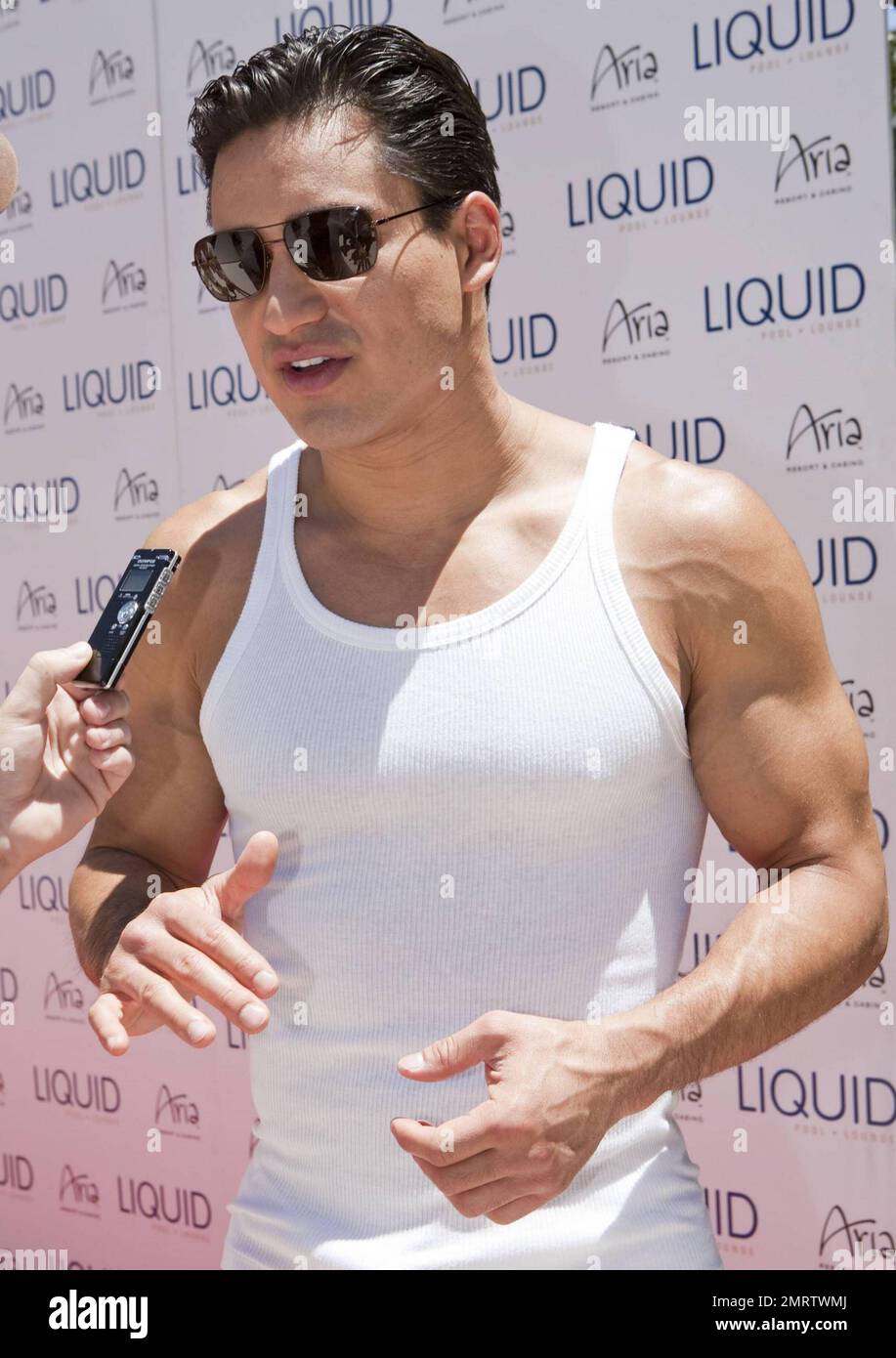 Actor and TV personality Mario Lopez shows off his very muscular arms ...