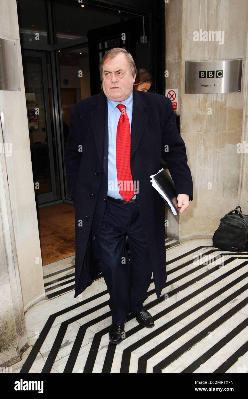 Lord John Prescott appears to grimace and scratch his face as he ...