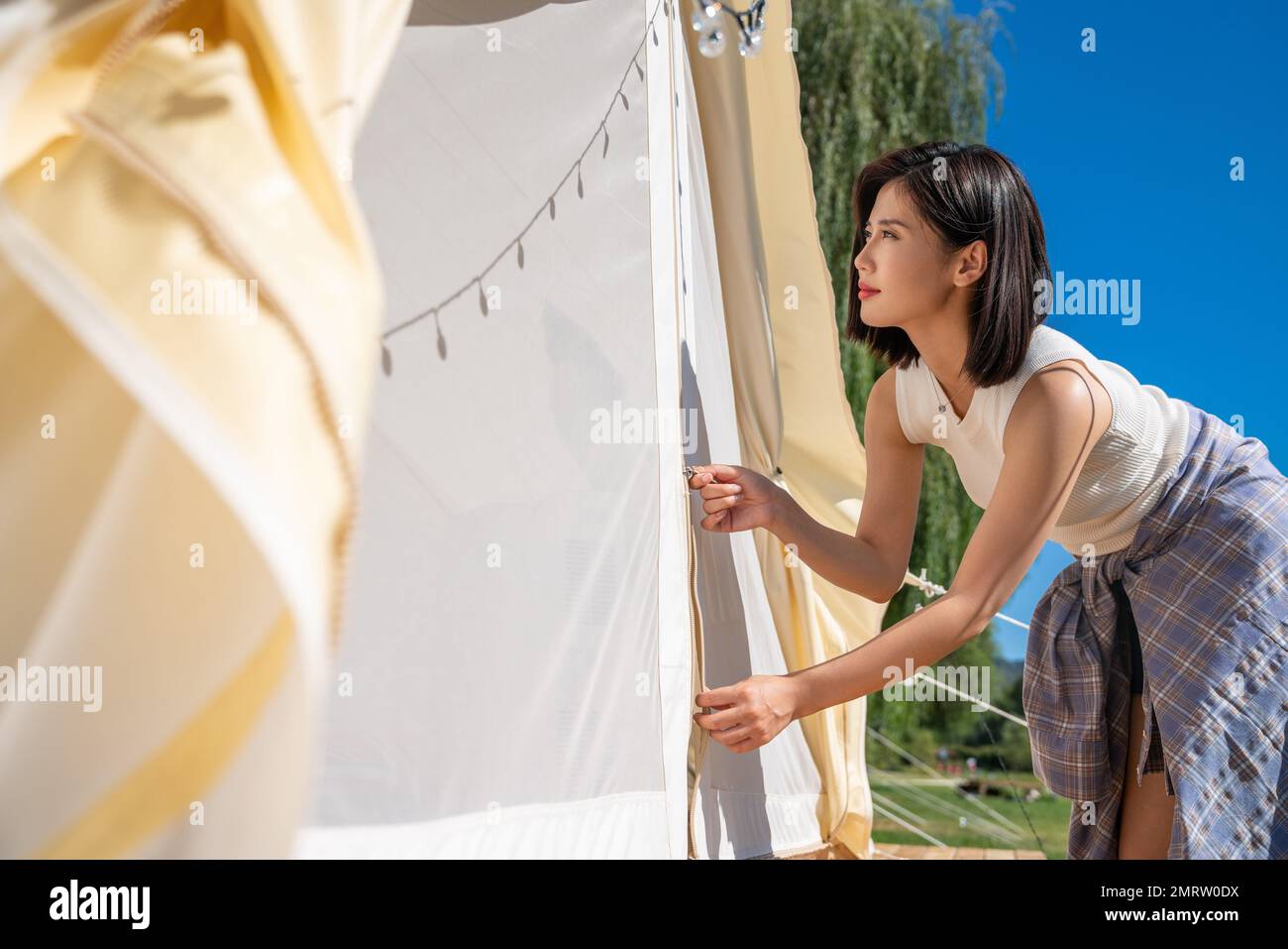 The girl in the land of camping tents Stock Photo - Alamy