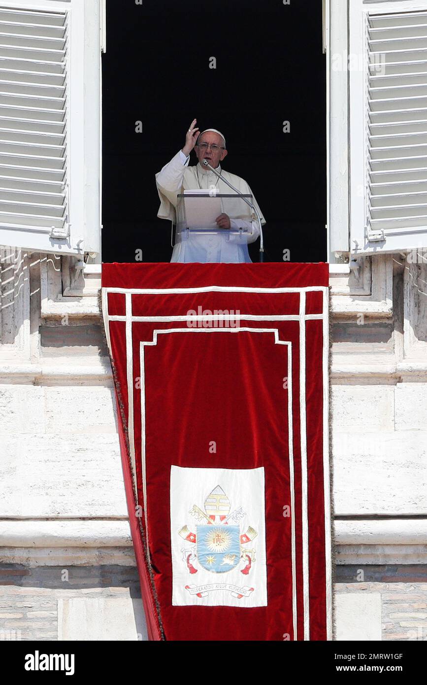 Pope Francis recites the Angelus noon prayer from the window of his ...
