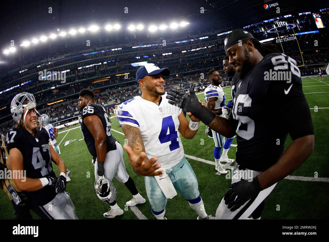 Oakland Raiders' James Cowser (47) and defensive lineman Denico Autry ...