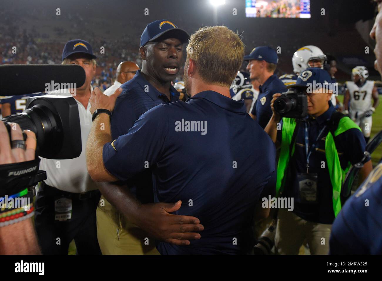 Los Angeles Chargers head coach Anthony Lynn, left, greets Los Angeles ...