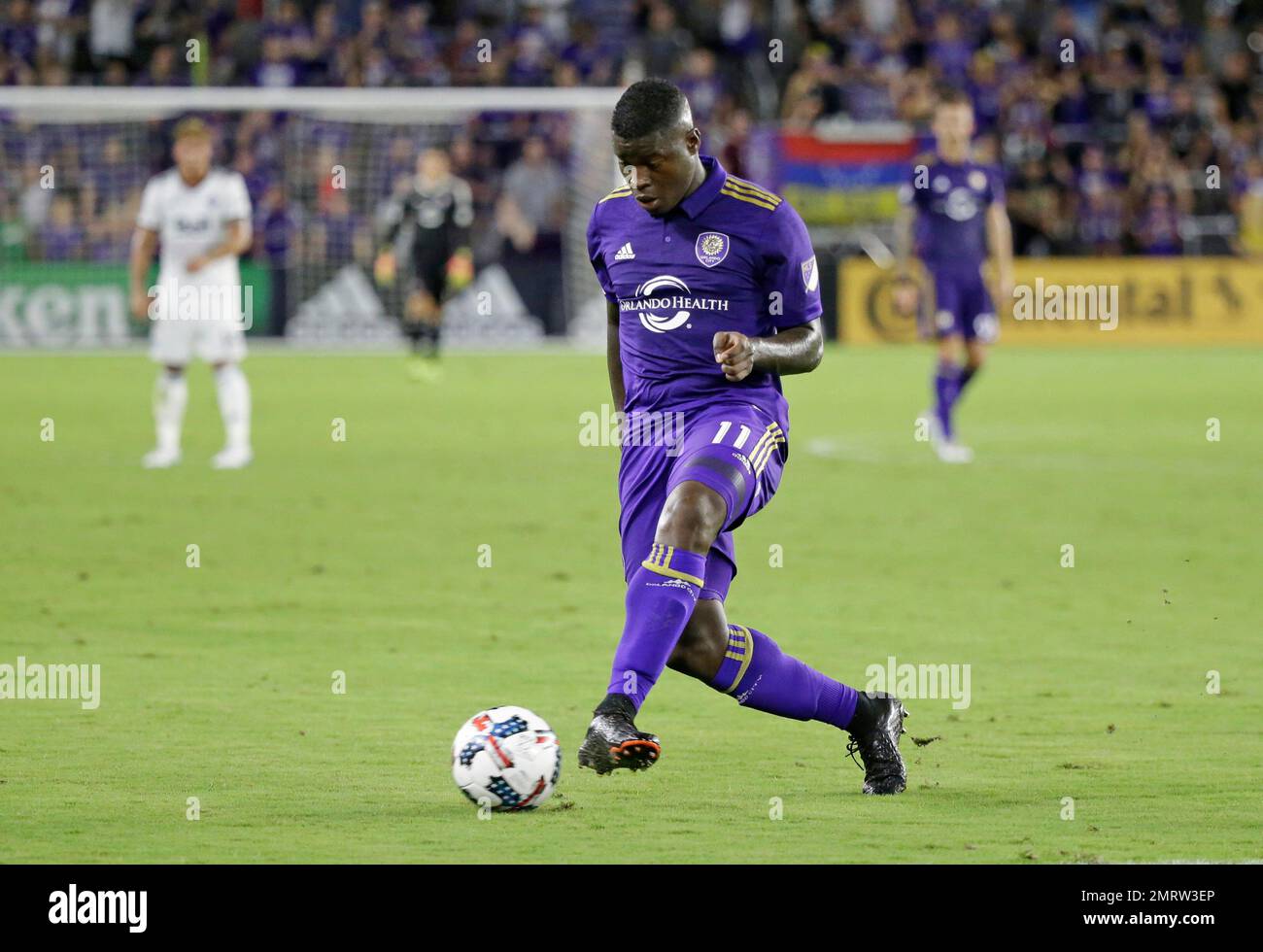 Orlando City 's Carlos Rivas (11) moves the ball against the Vancouver ...