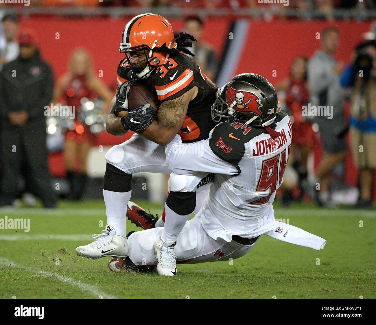 Cleveland Browns running back Terrence Magee (33) is stopped by Tampa ...