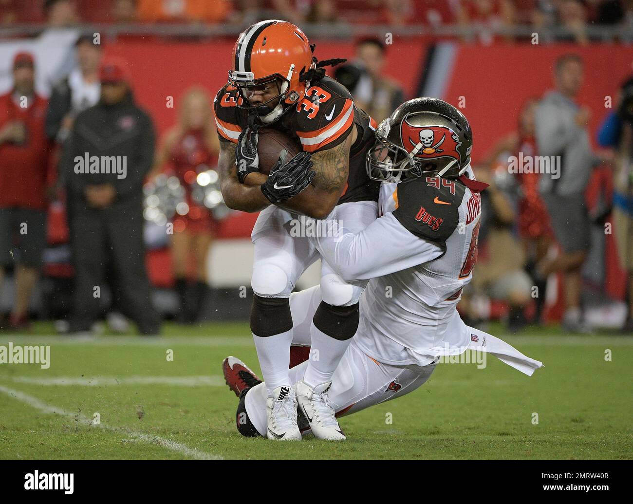 Cleveland Browns running back Terrence Magee (33) is stopped by Tampa ...