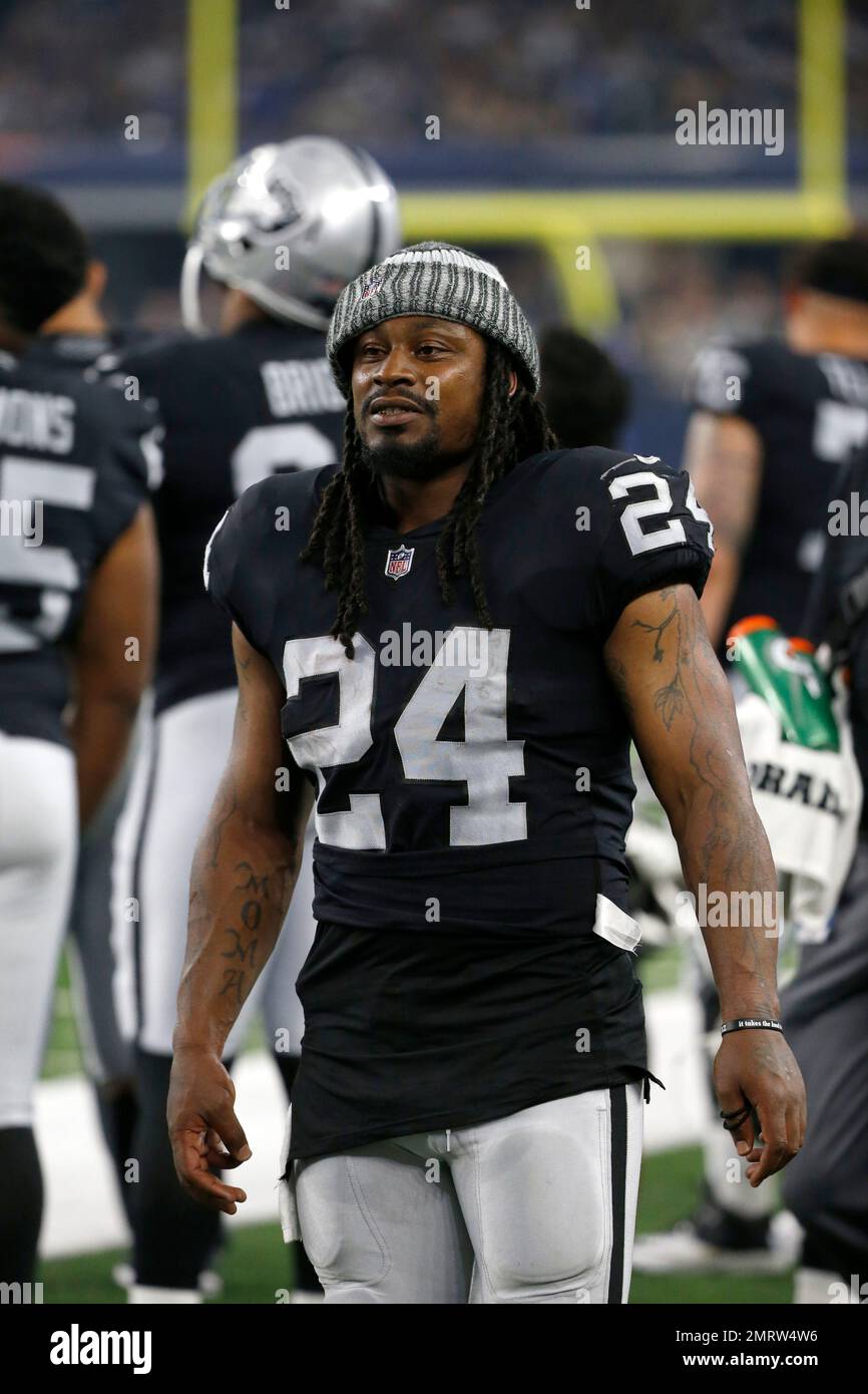 Oakland Raiders running back Marshawn Lynch (24) walks along the ...