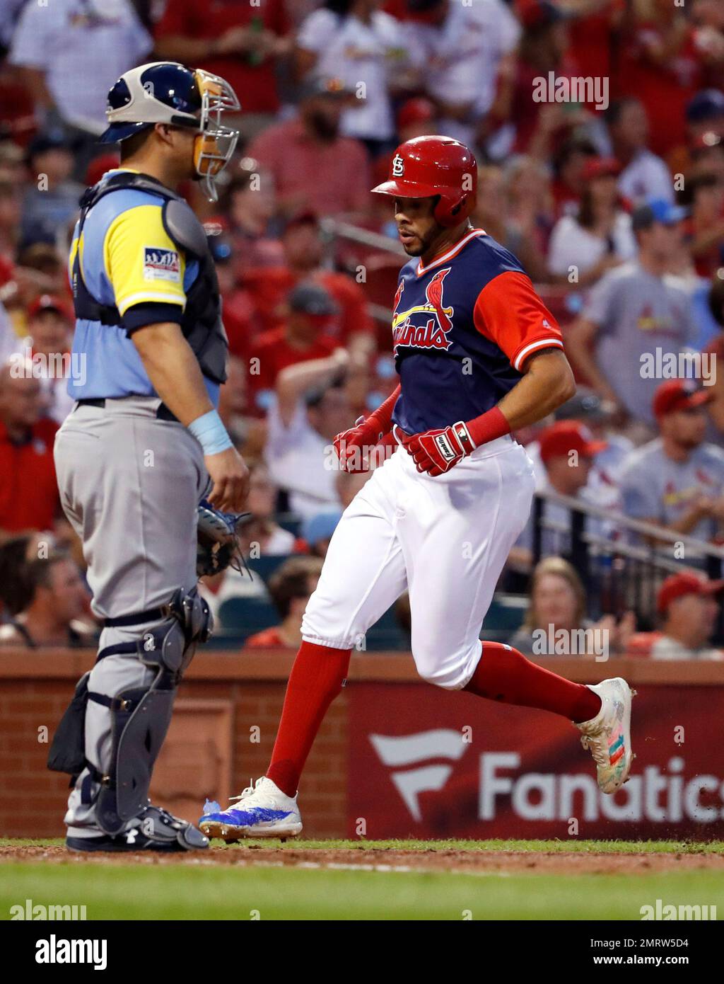 St. Louis Cardinals' Tommy Pham, right, scores past Tampa Bay Rays ...