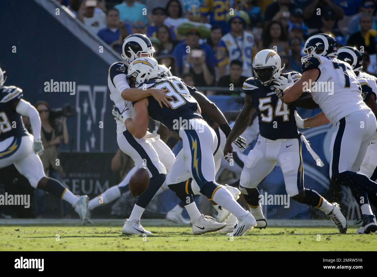Los Angeles Rams quarterback Jared Goff fumbles as he is hit by Los ...
