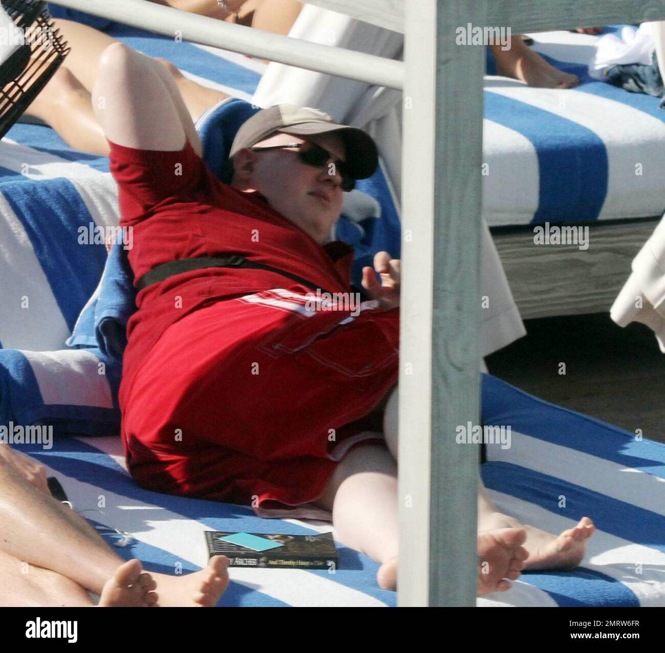 British comedic actor, Matt Lucas, lounges poolside wearing a matching ...