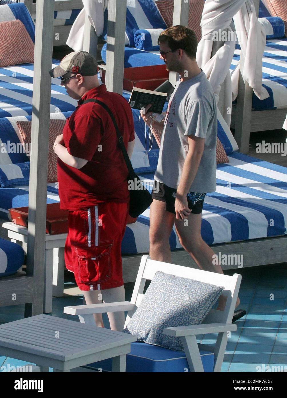 British comedic actor, Matt Lucas, lounges poolside wearing a matching ...