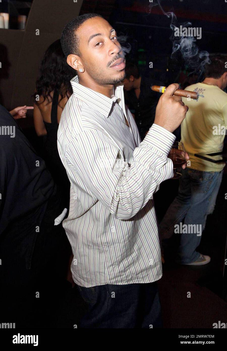 EXCLUSIVE!! Rapper Ludacris enjoys a cigar and a drink while partying ...