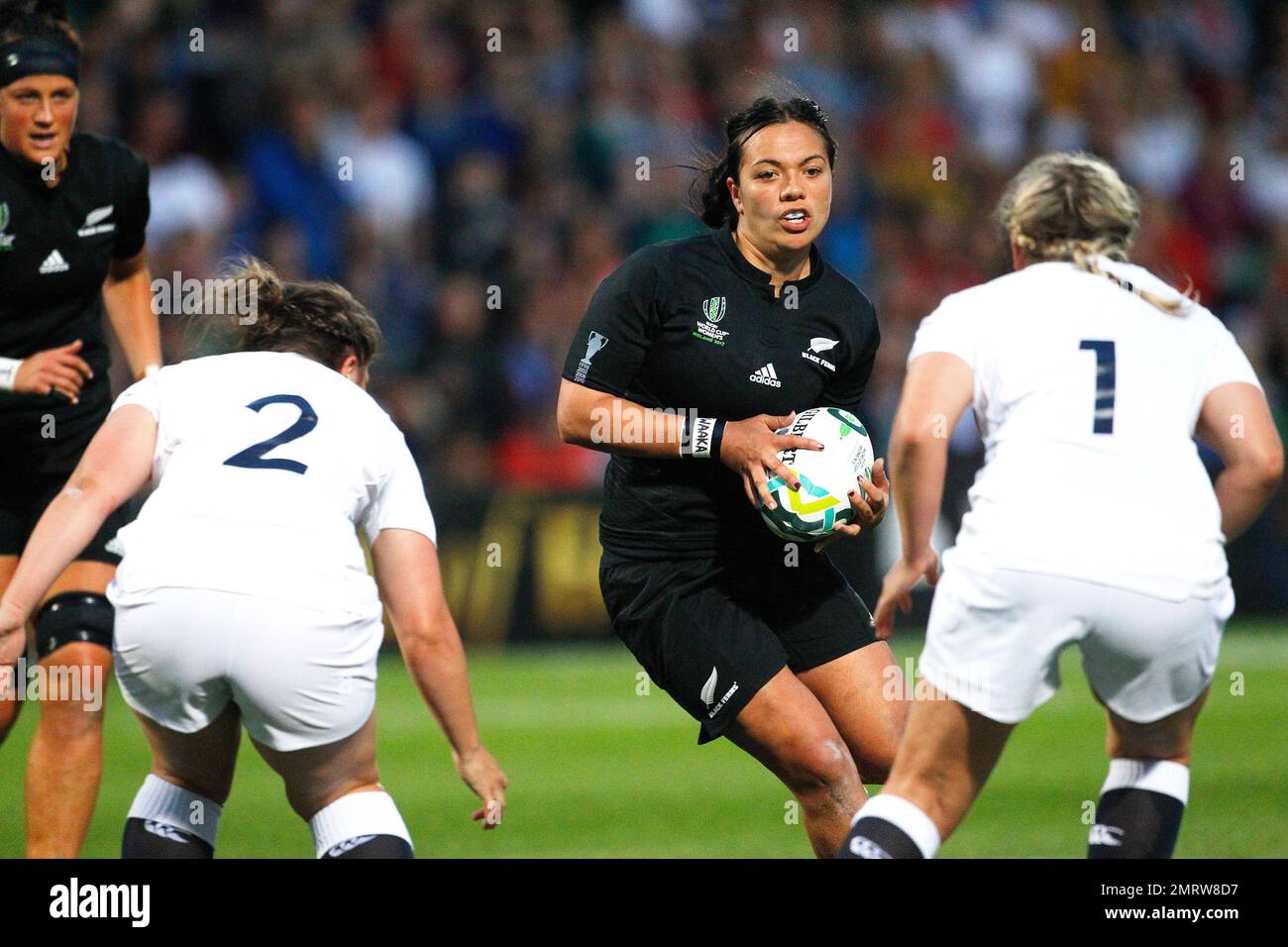 New Zealand's Stacey Waaka, centre, is blocked by England's Amy Cokayne ...