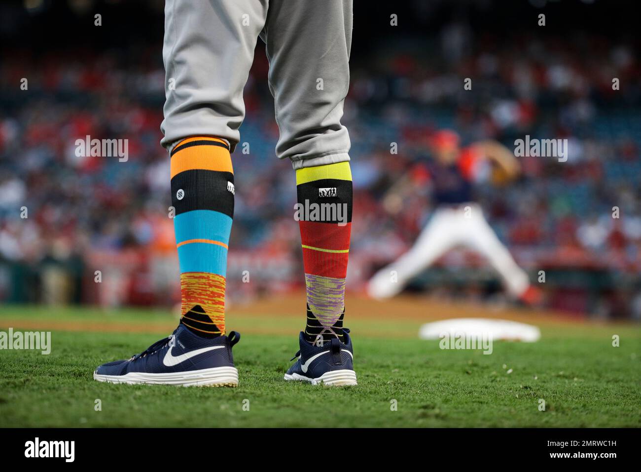 Houston Astros third base coach Gary Pettis wears a pair of colorful ...