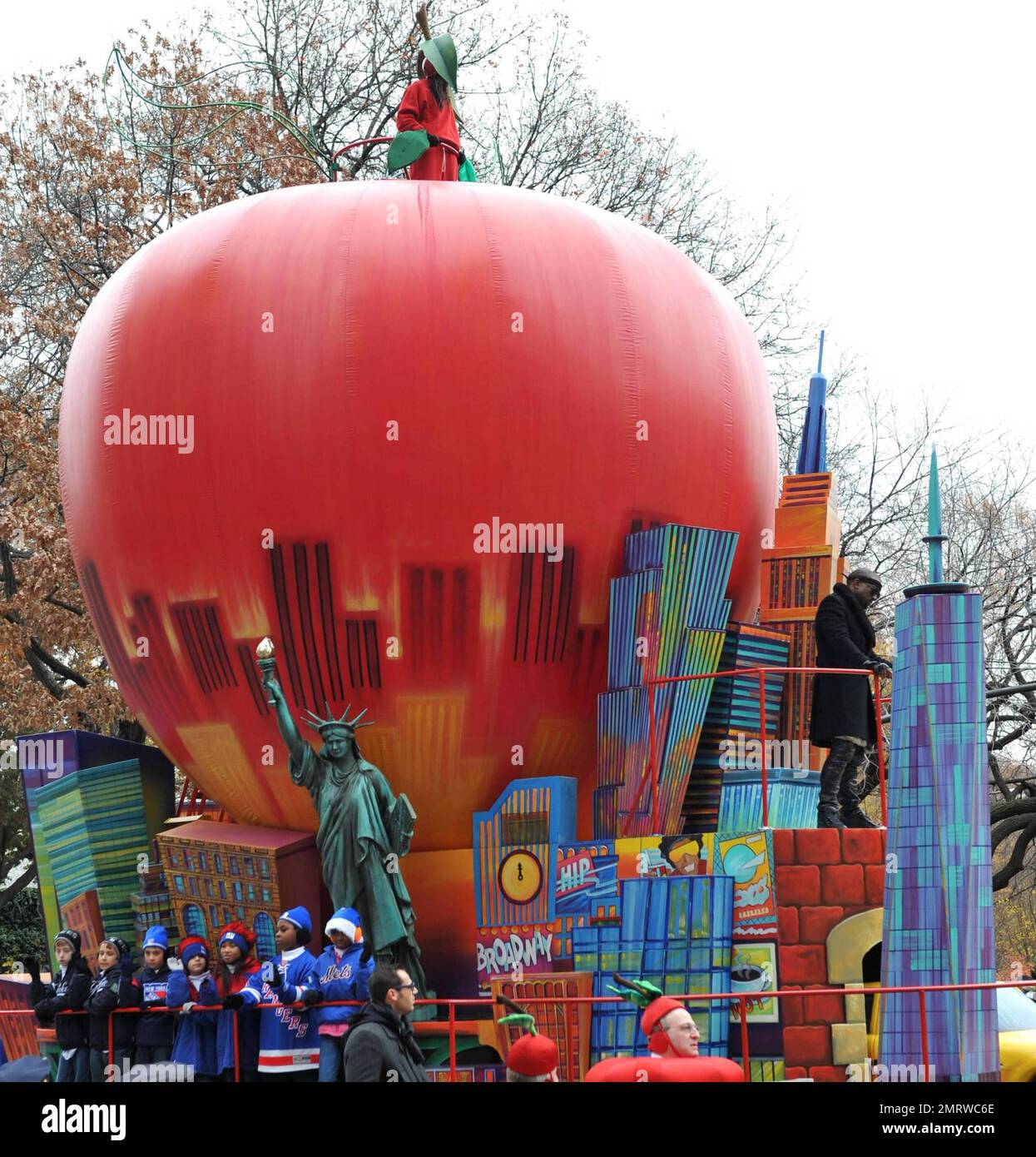 Kanye West on his apple and city float during the 84th annual Macy's ...