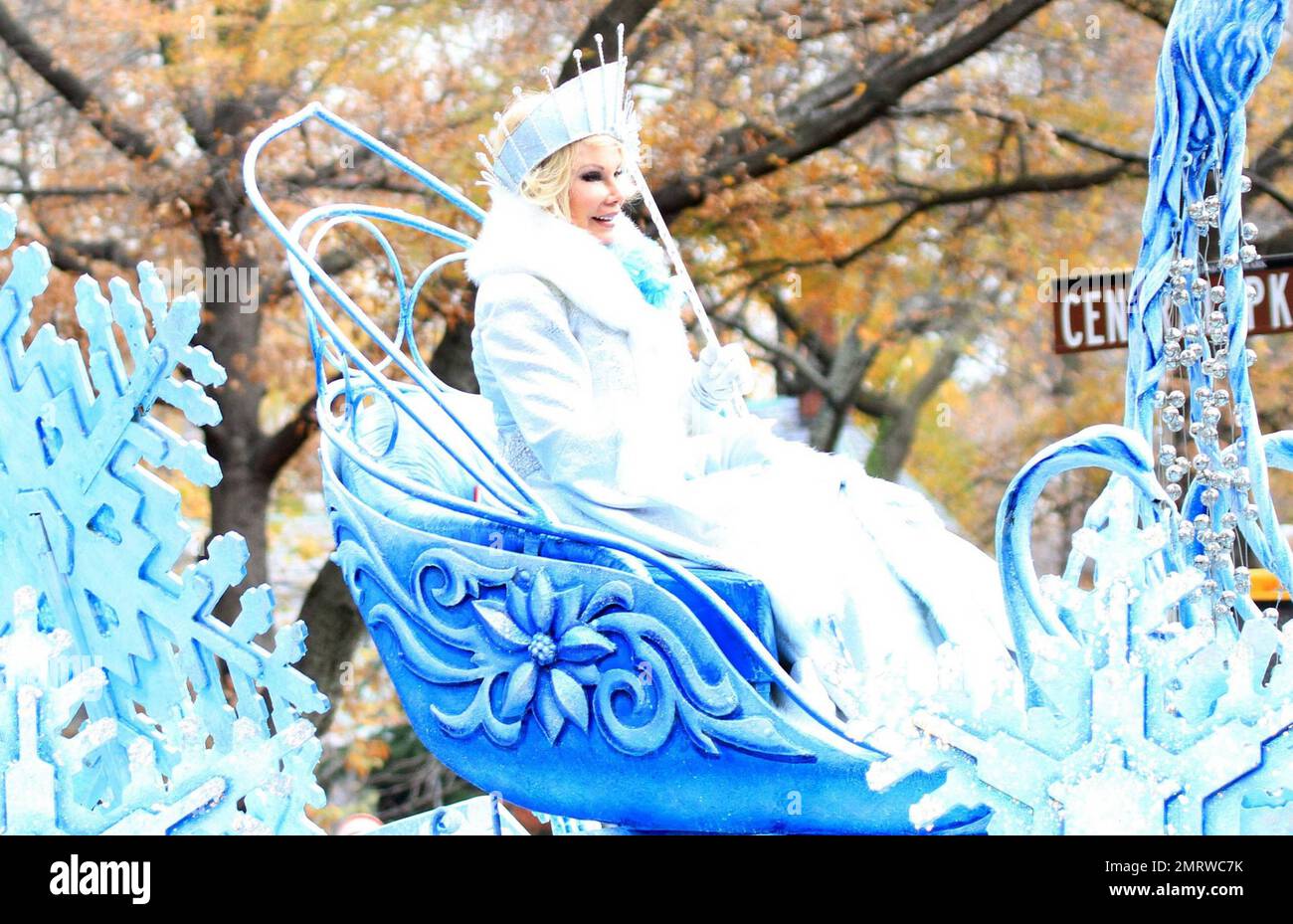 In what appears to be an Ice Queen costume, Joan Rivers rides on a ...