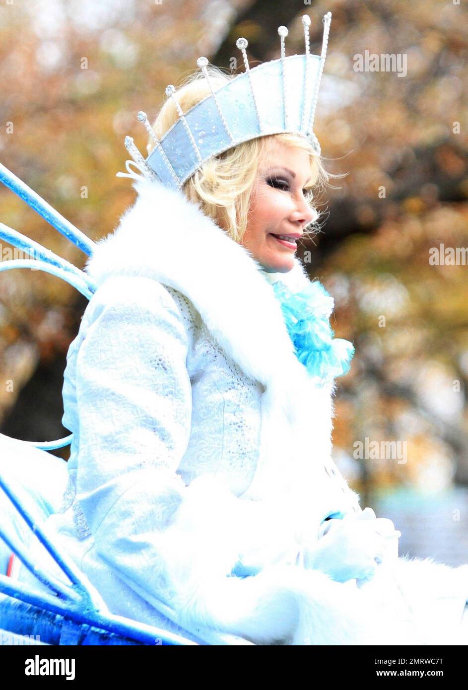 In what appears to be an Ice Queen costume, Joan Rivers rides on a ...